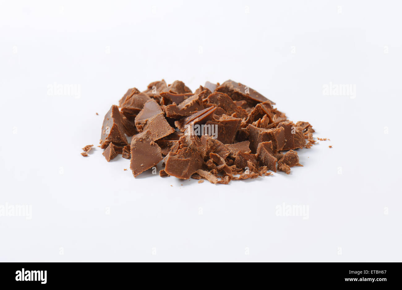 heap of chocolate pieces on white background Stock Photo - Alamy