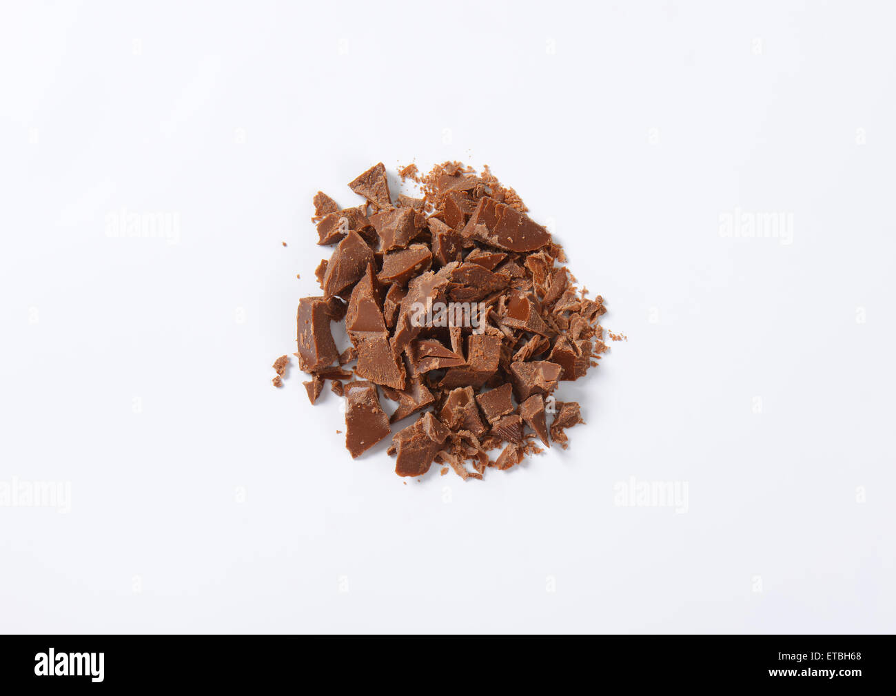 heap of chocolate pieces on white background Stock Photo - Alamy