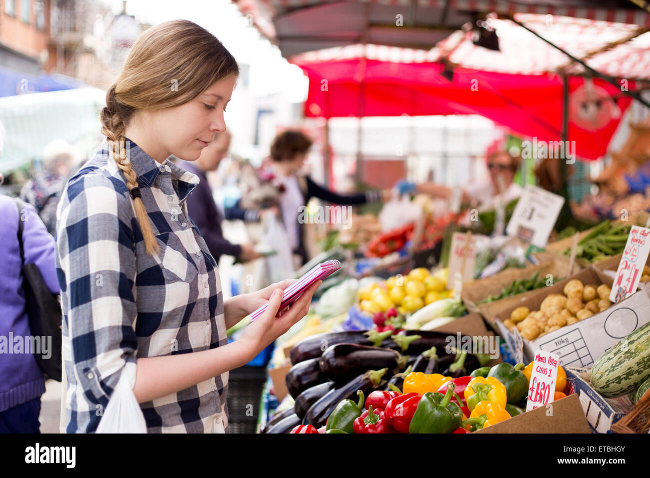 young woman reading her shopping list Stock Photo - Alamy