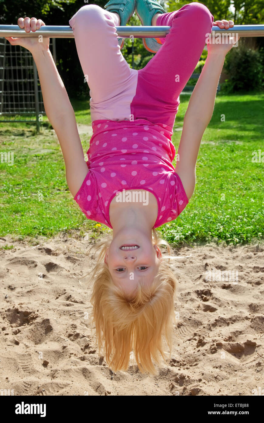 Girl hanging upside down hi-res stock photography and images - Alamy