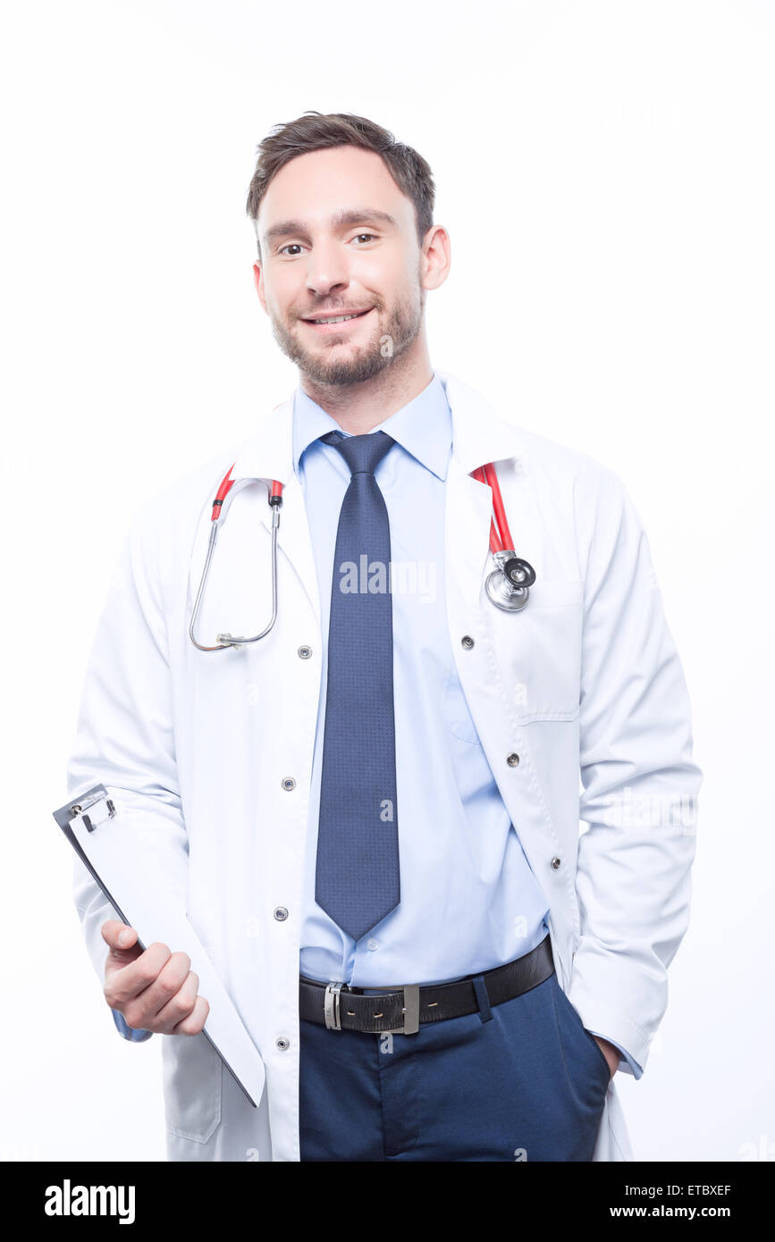 Smiling doctor holding the papers Stock Photo - Alamy