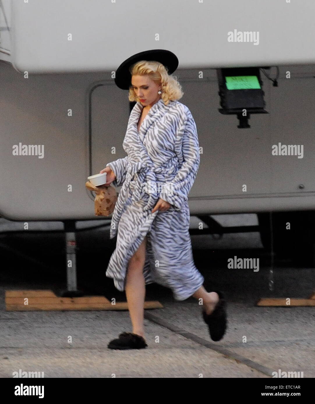 Blonde bombshell Scarlett Johansson wears a zebra print bathrobe on the ...