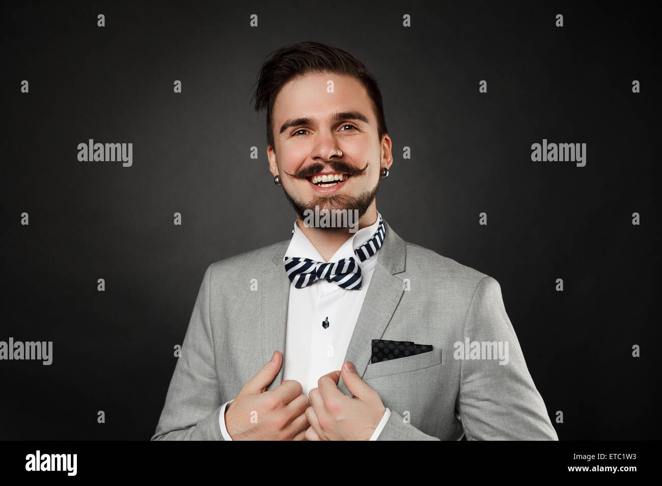 handsome guy with beard and mustache in suit Stock Photo - Alamy