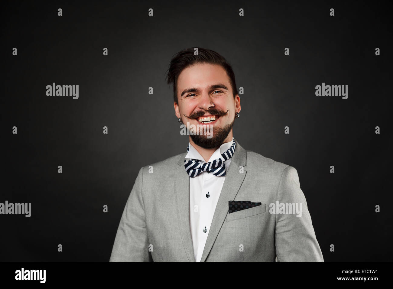 handsome guy with beard and mustache in suit Stock Photo - Alamy
