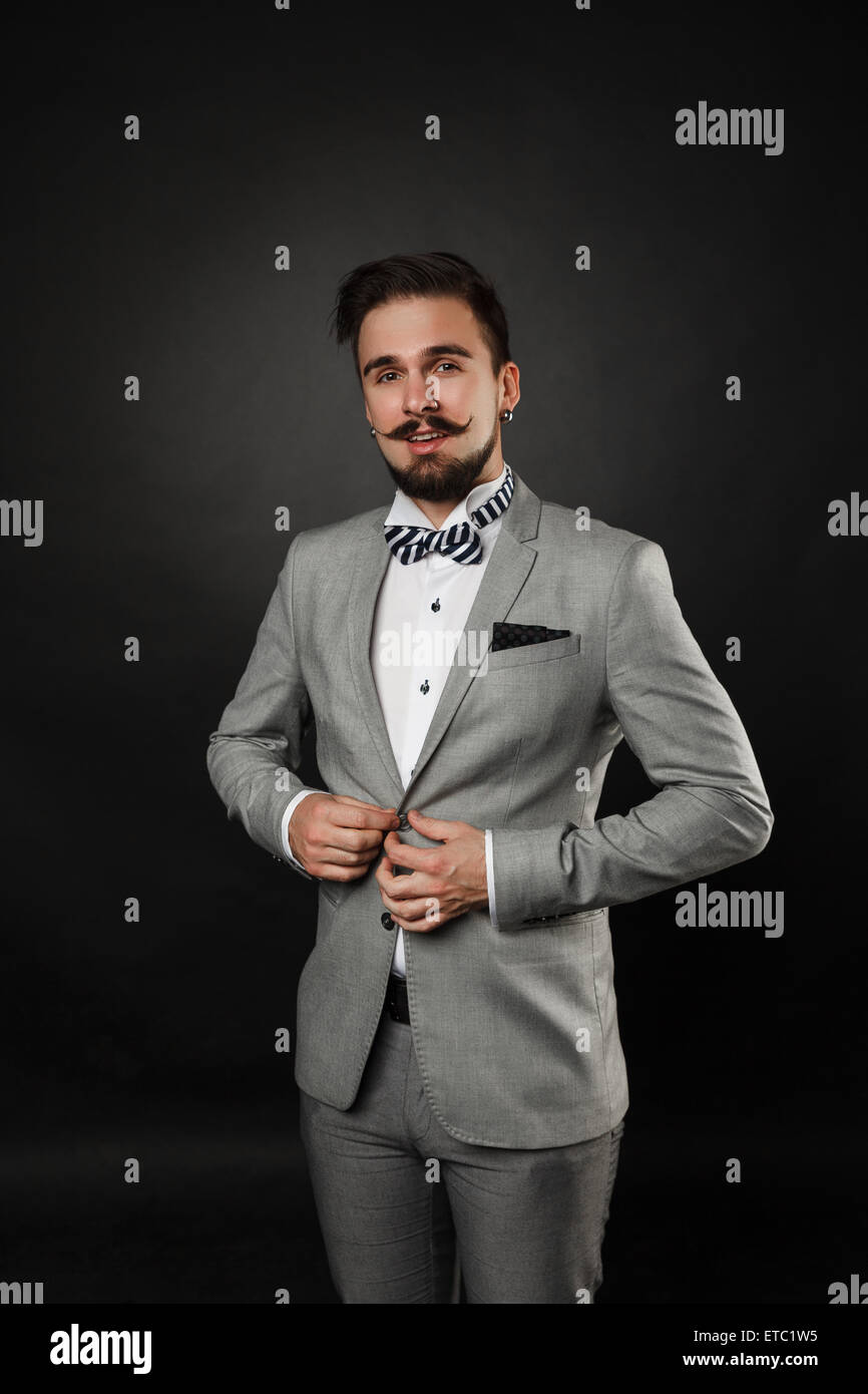 handsome guy with beard and mustache in suit Stock Photo - Alamy