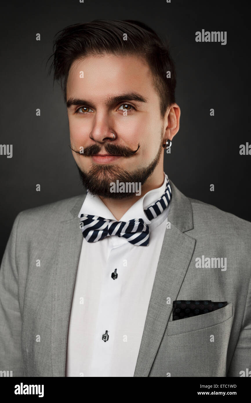handsome guy with beard and mustache in suit Stock Photo - Alamy