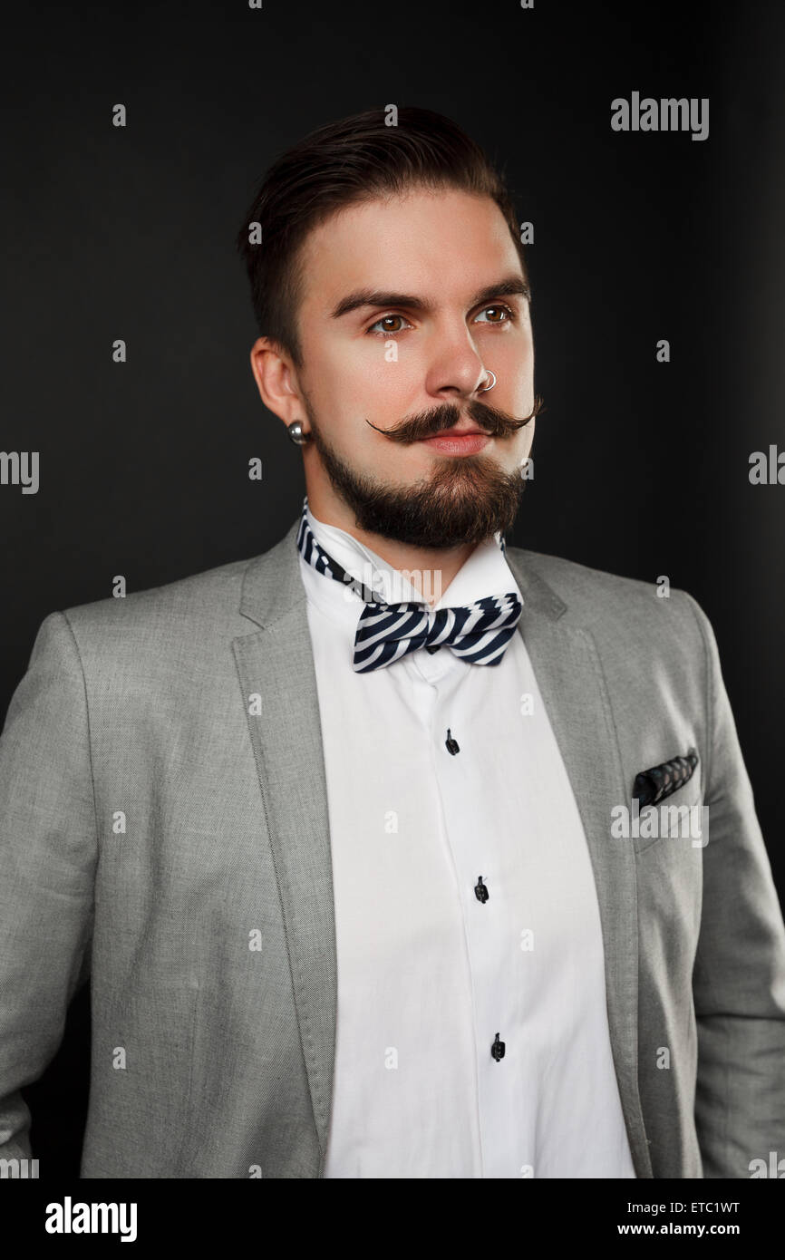 handsome guy with beard and mustache in suit Stock Photo - Alamy