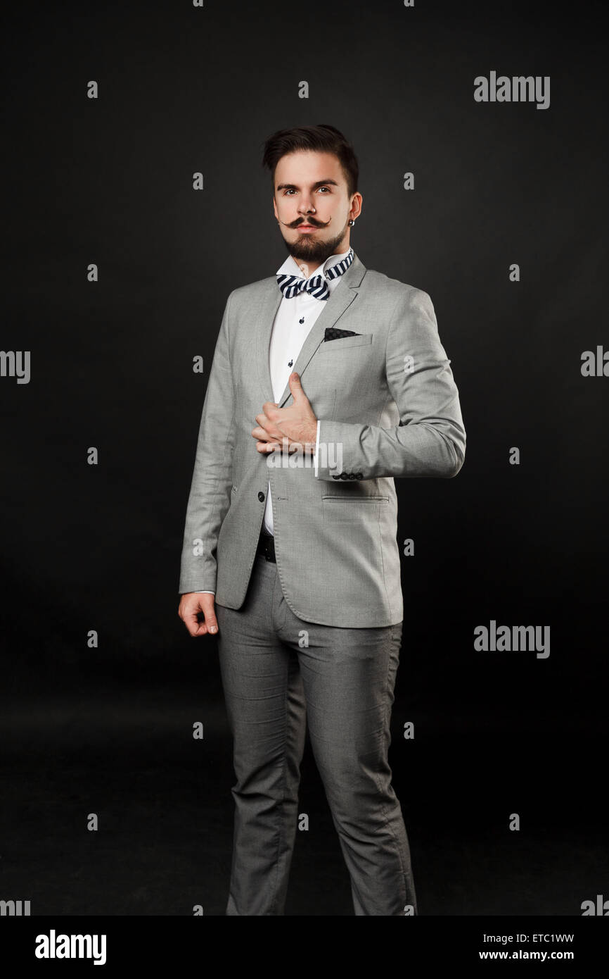 handsome guy with beard and mustache in suit Stock Photo - Alamy