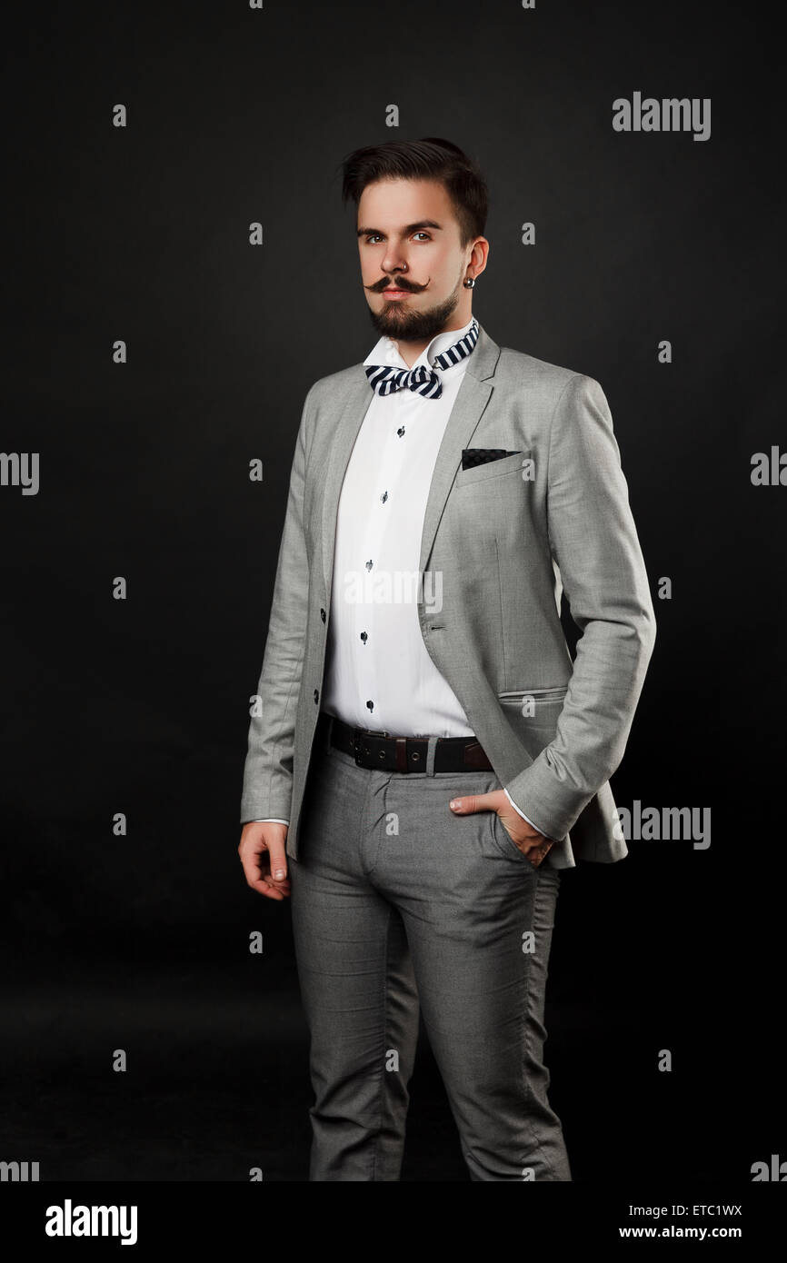 handsome guy with beard and mustache in suit Stock Photo - Alamy