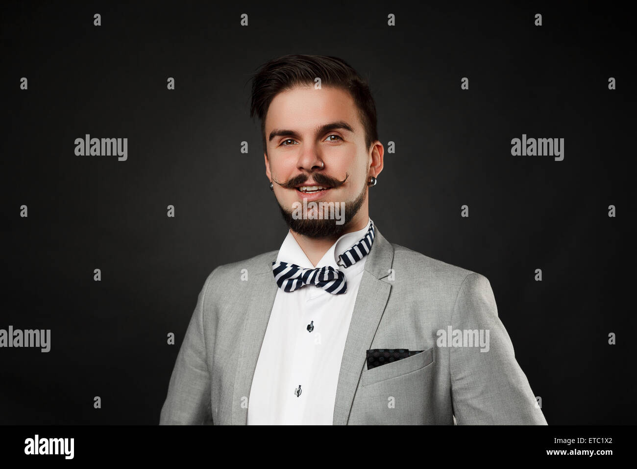 handsome guy with beard and mustache in suit Stock Photo - Alamy
