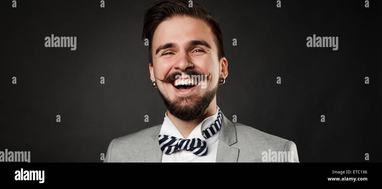 handsome guy with beard and mustache in suit Stock Photo - Alamy