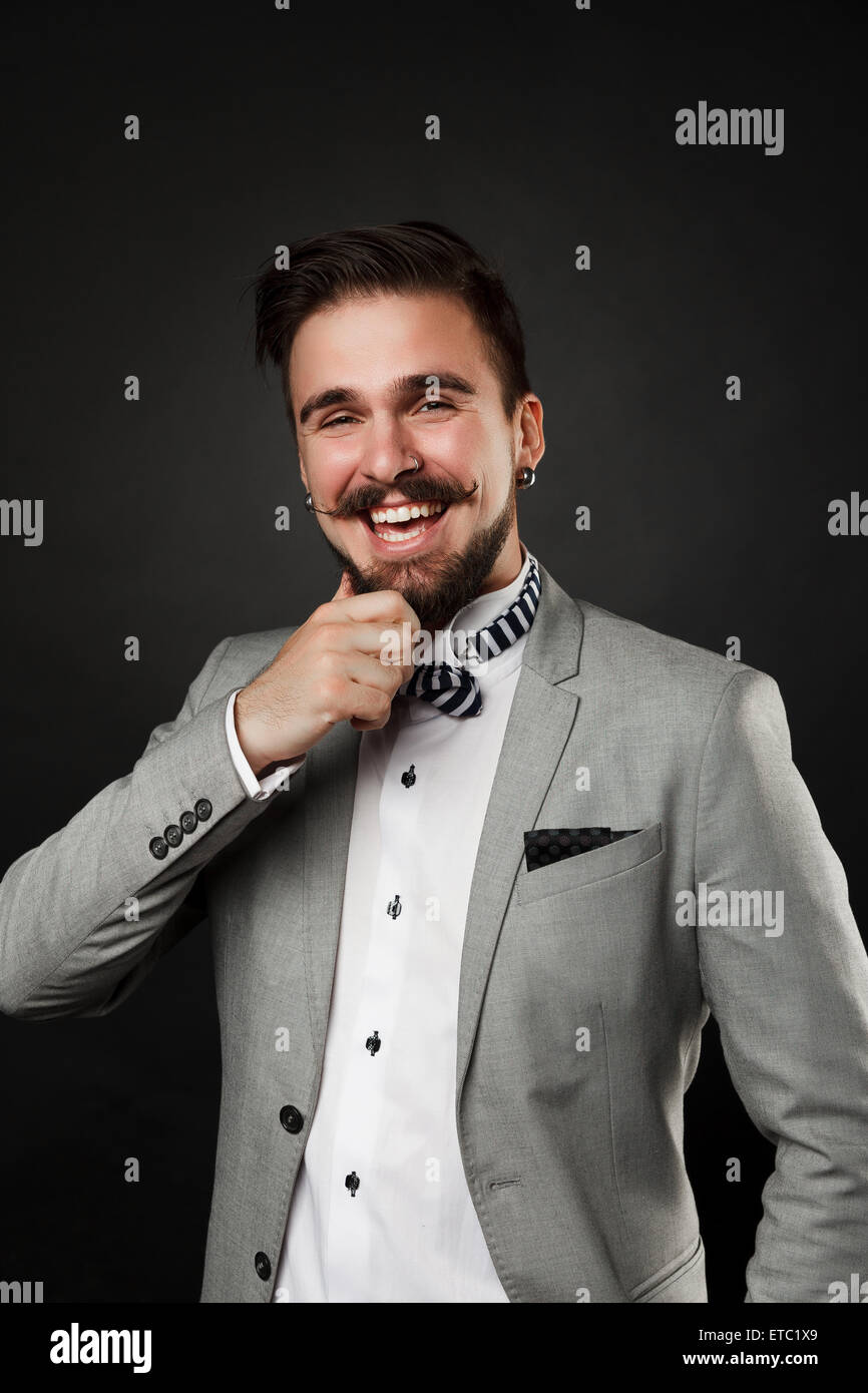 handsome guy with beard and mustache in suit Stock Photo - Alamy