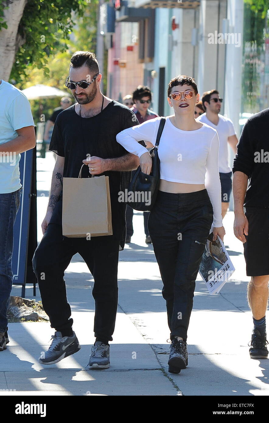 Rose McGowan rocks a crop top and purple lipstick while out shopping ...