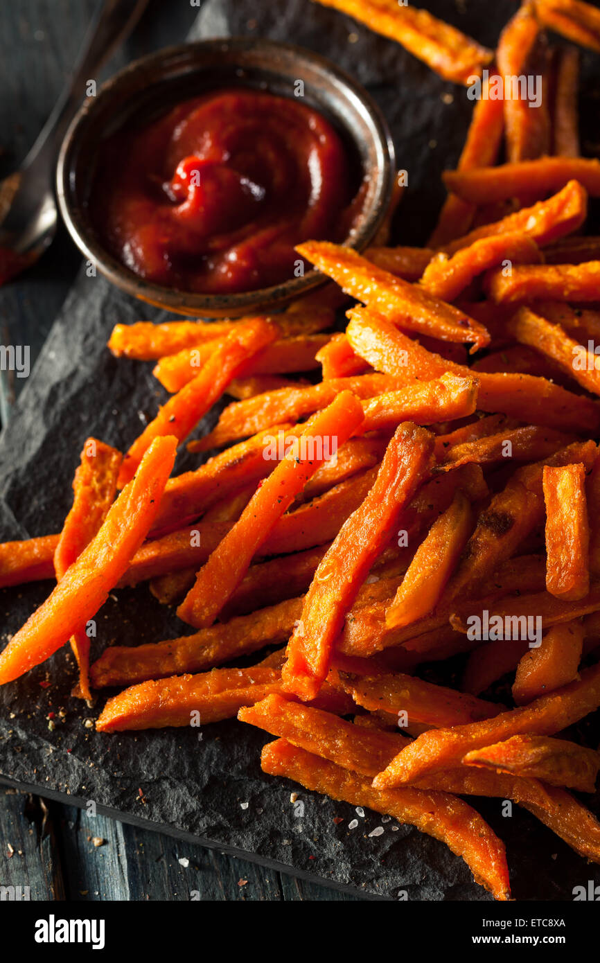 Homemade Orange Sweet Potato Fries with Salt and Pepper Stock Photo - Alamy