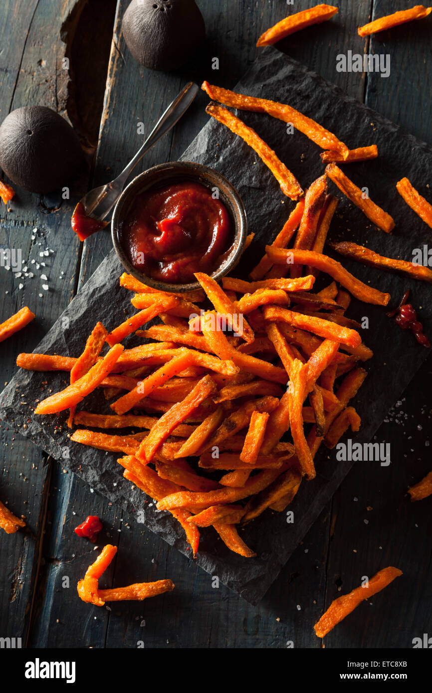 Homemade Orange Sweet Potato Fries with Salt and Pepper Stock Photo - Alamy