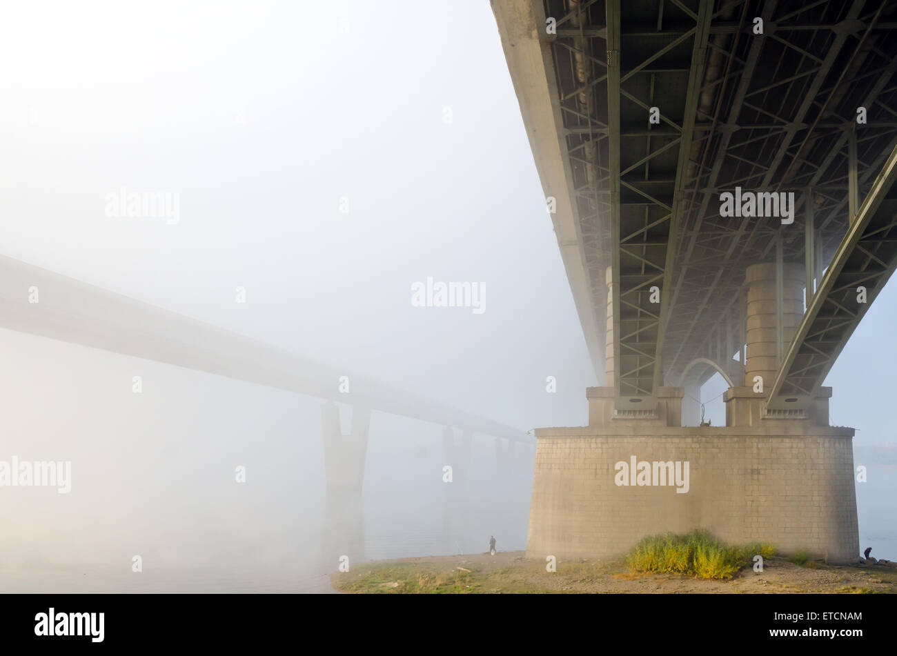 Stone and steel bridge in strong fog in the morning Stock Photo - Alamy