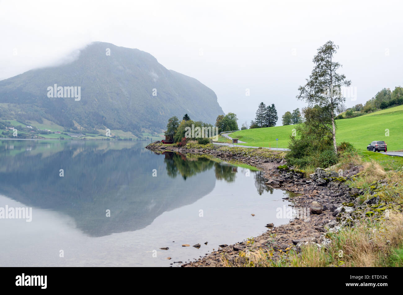 Reflection in Norway fjord at fall time Stock Photo - Alamy