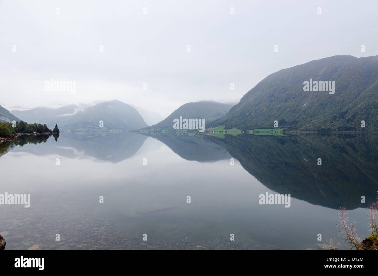 Reflection in Norway fjord at fall time Stock Photo - Alamy