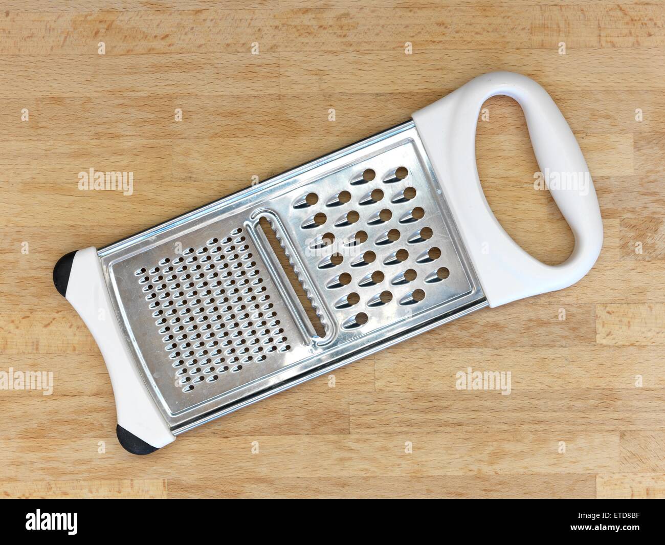 A close up shot of a food grater Stock Photo - Alamy