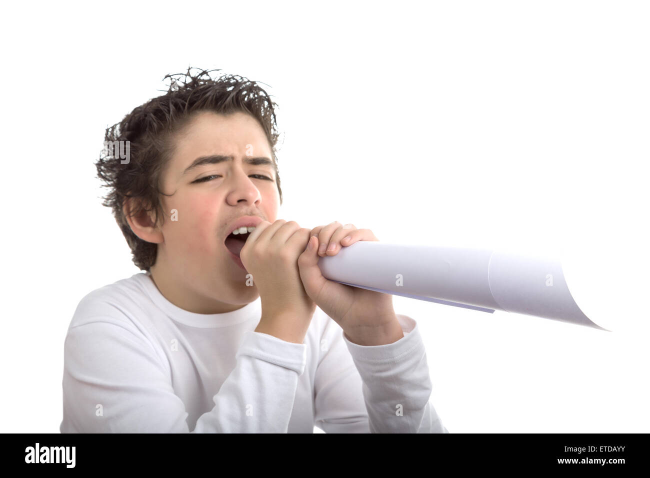 Cute hispanic boy with questioning eyes shouts in a fake megaphone made ...