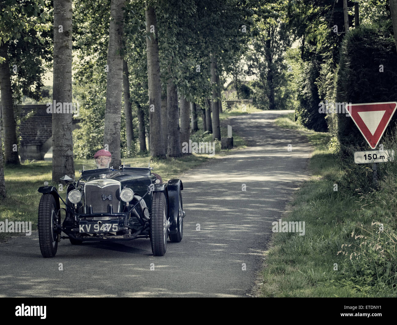 1934 Riley Ulster Imp driving on a French country road Stock Photo - Alamy