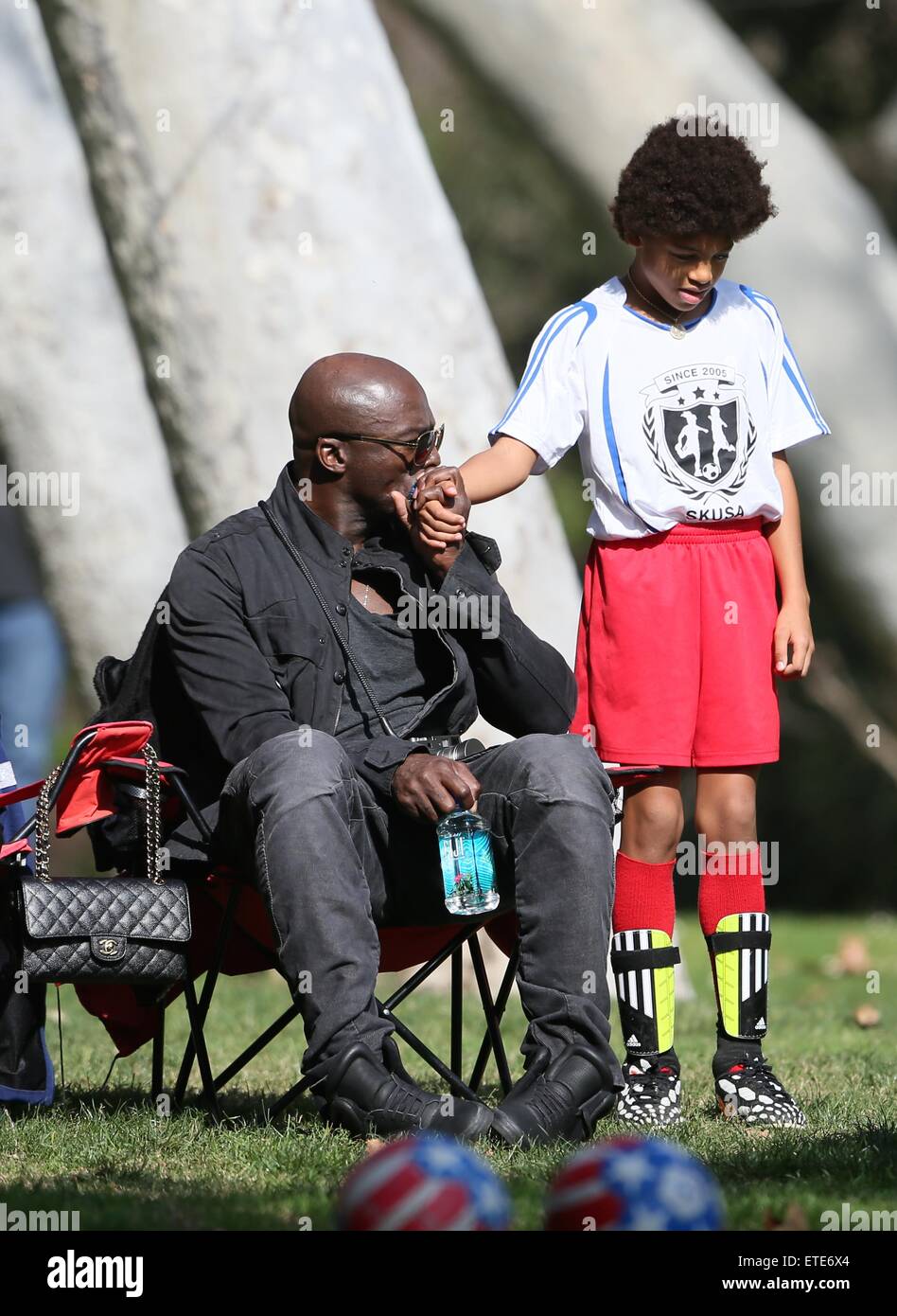 Seal watches his children play in a soccer game Featuring: Seal Samuel ...