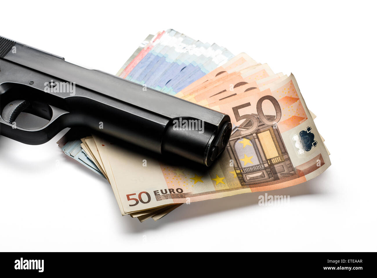 Bunch of euro banknotes of various denominations with a gun. Isolated ...