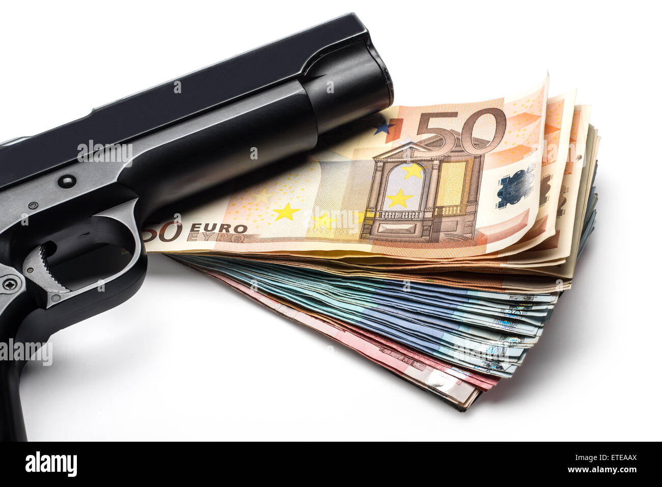 Bunch of euro banknotes of various denominations with a gun. Isolated ...