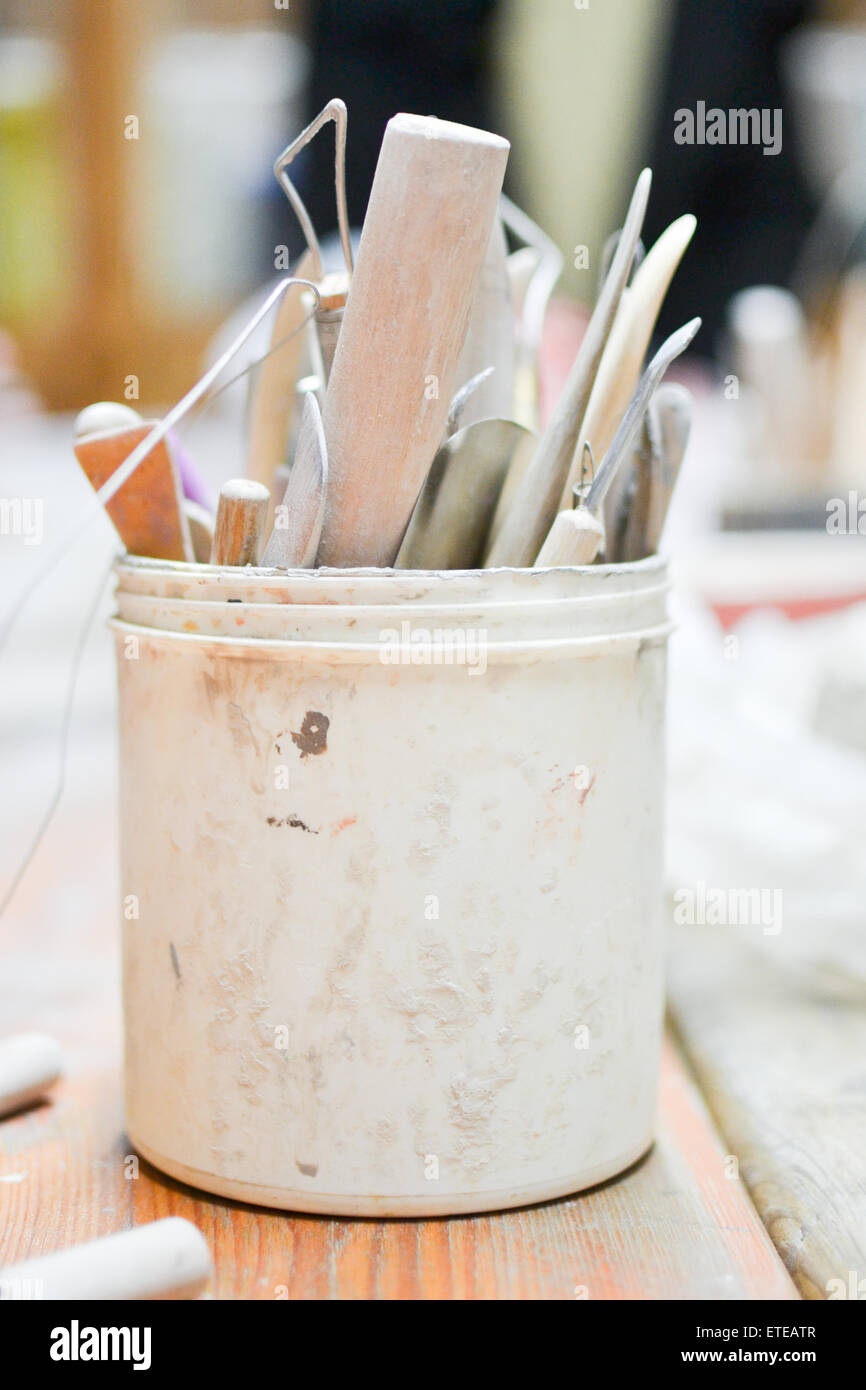 Pottery tools in a pot Stock Photo - Alamy