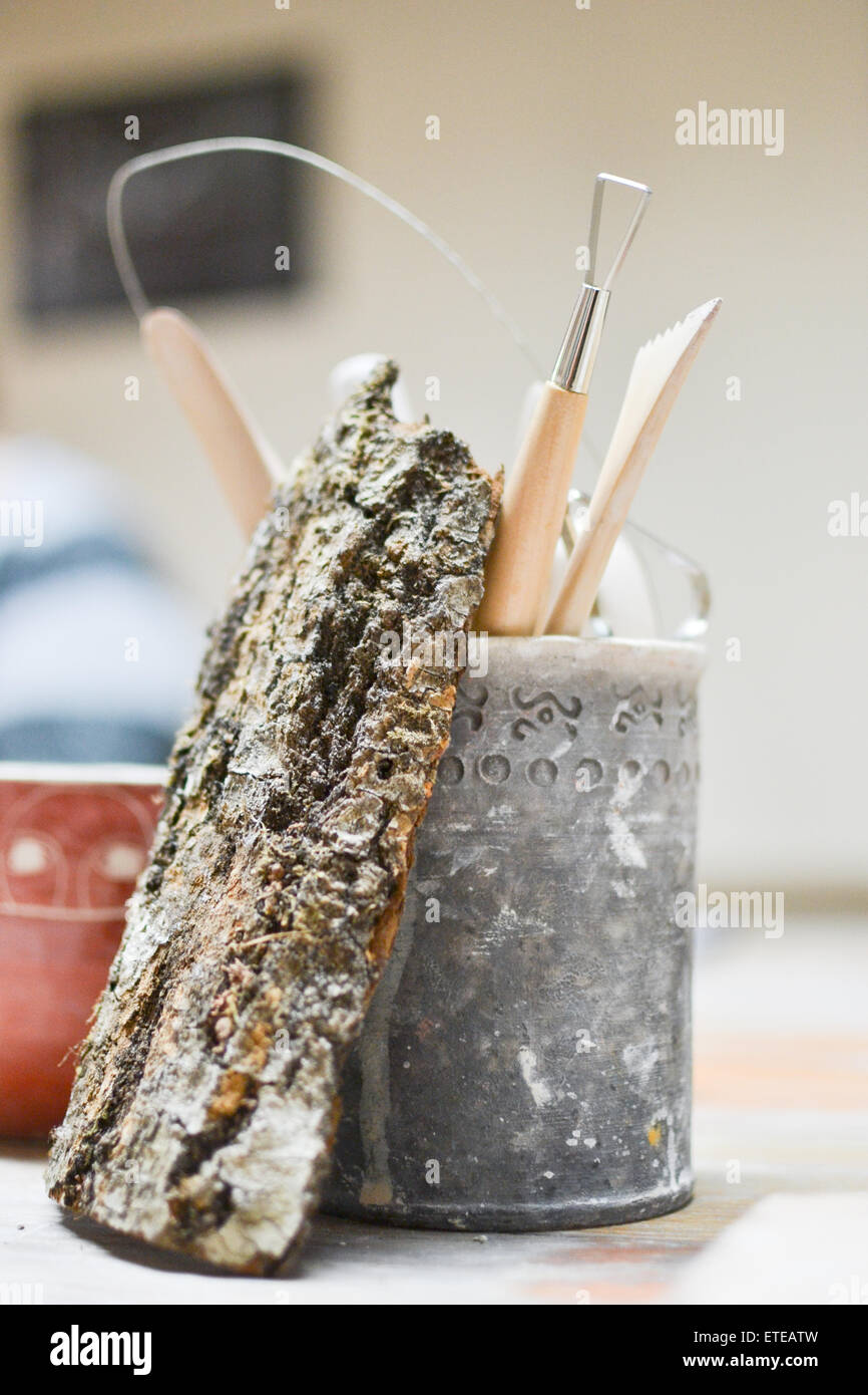 Pottery tools in a pot Stock Photo - Alamy