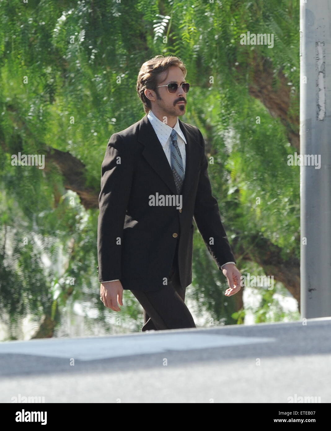 Ryan Gosling puts on a vintage suit for a scene in his new movie 'The ...