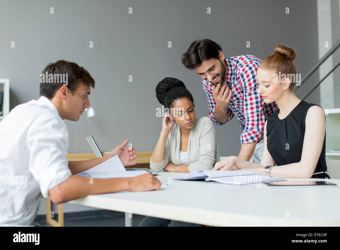 Young people in the office Stock Photo - Alamy