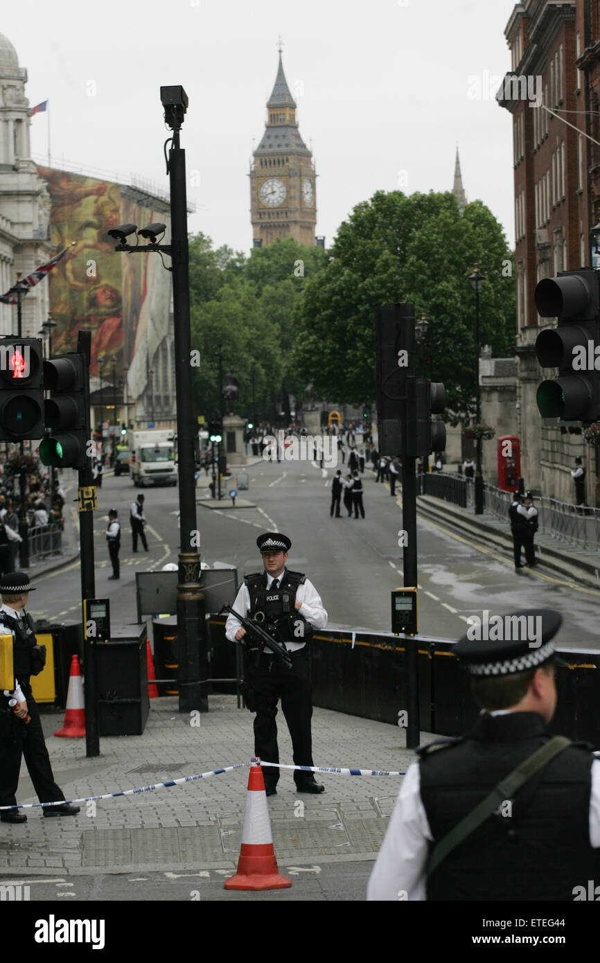 London, UK. 13th June, 2015. Police officers stand guard along the ...