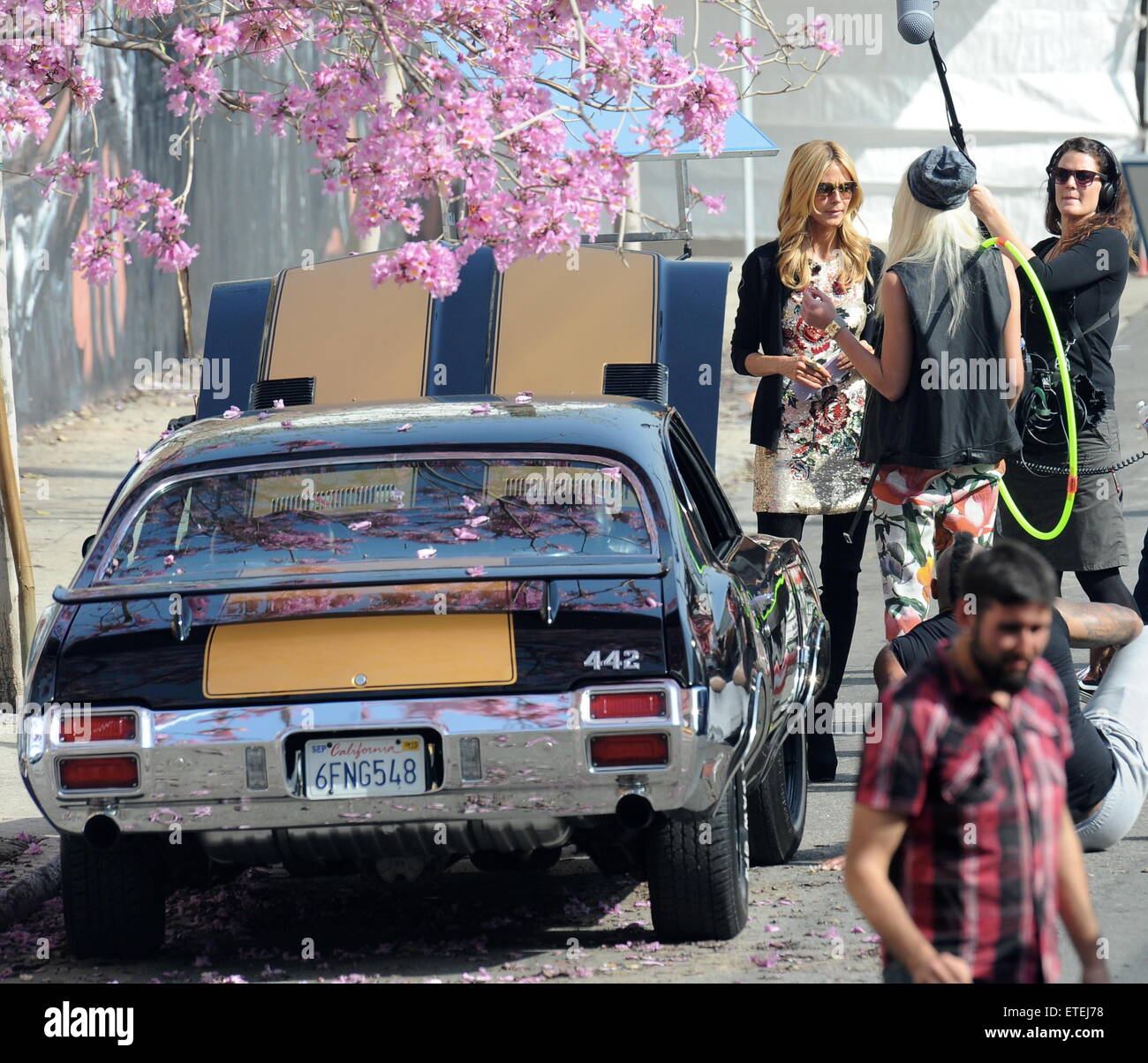 Super model Heidi Klum directs cast members and models to their ...