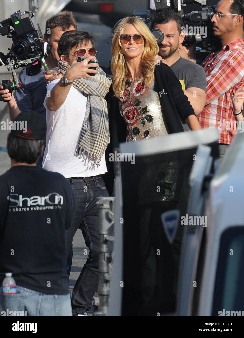 Super model Heidi Klum directs cast members and models to their ...