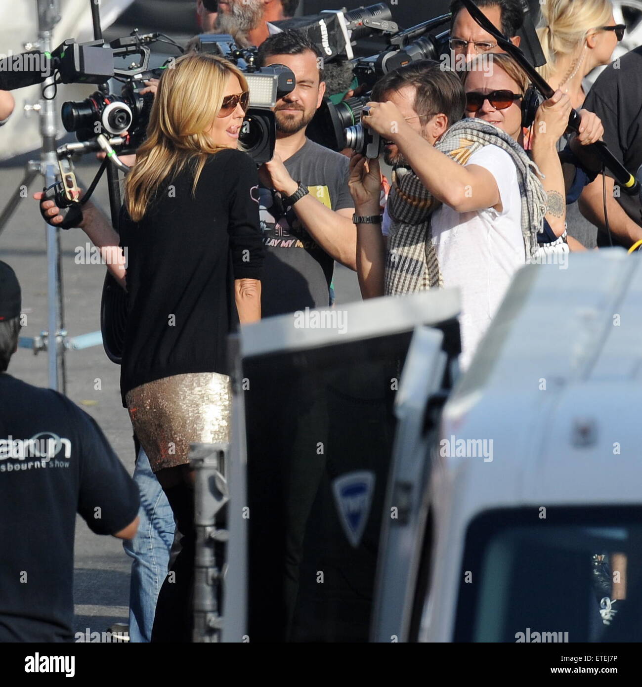 Super model Heidi Klum directs cast members and models to their ...
