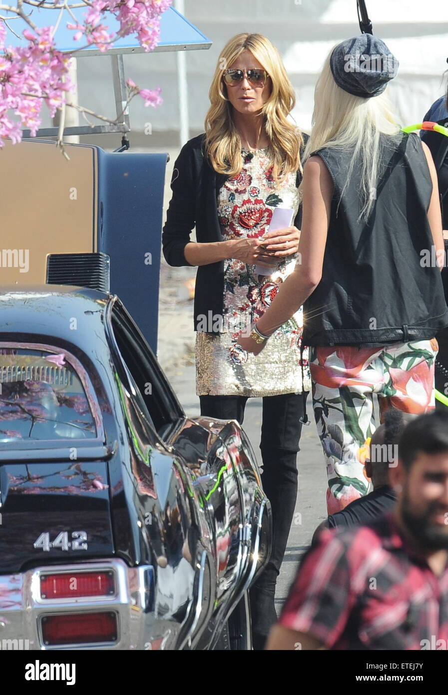 Super model Heidi Klum directs cast members and models to their ...