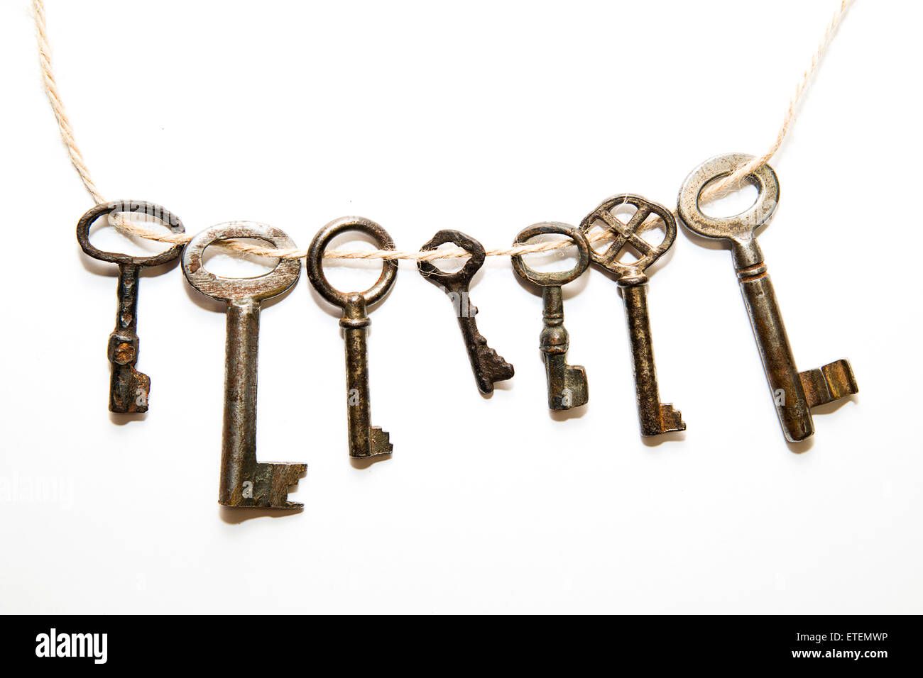 Some vintage keys from the locks on a white background Stock Photo - Alamy