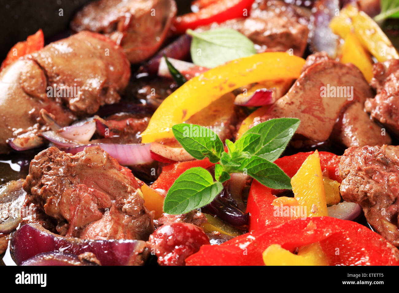 Chicken liver and bell pepper stir fry Stock Photo - Alamy