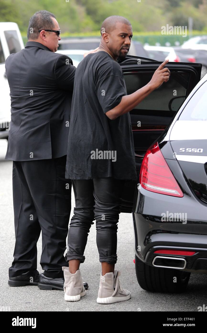Kim Kardashian and Kanye West arrive at the Roc-Nation Pre-Grammy party ...