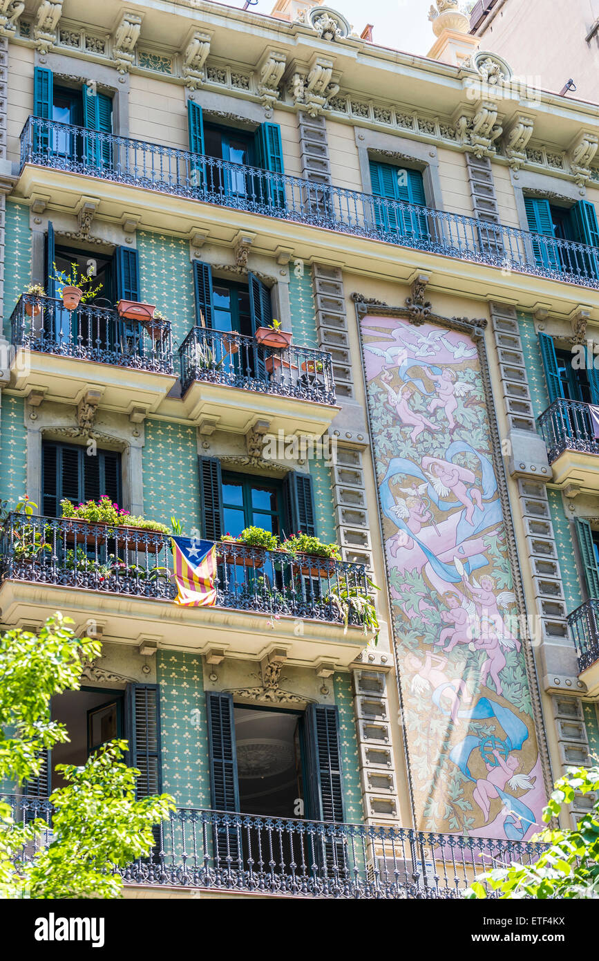 Facade of a classical building with paintings on Paradise in Barcelona ...