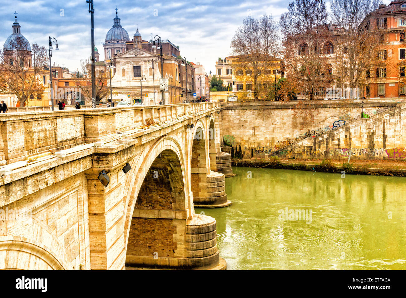 Bridge over the Tiber river in the center of Rome. Basilica of St ...