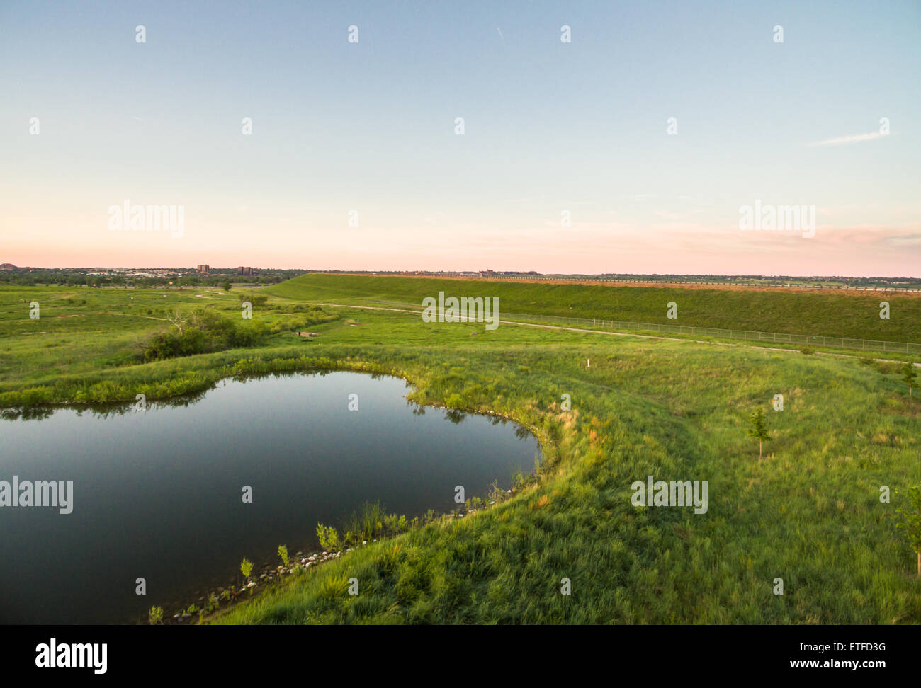 Aerial view of small pond in grass land at sunset Stock Photo - Alamy