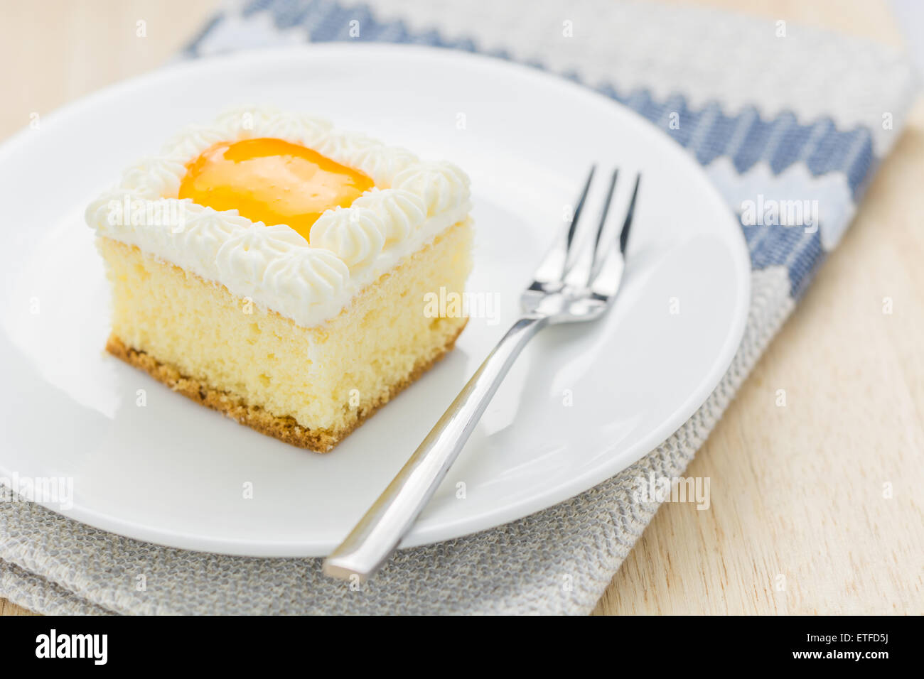 The orange flavor in the cake squares white Stock Photo - Alamy