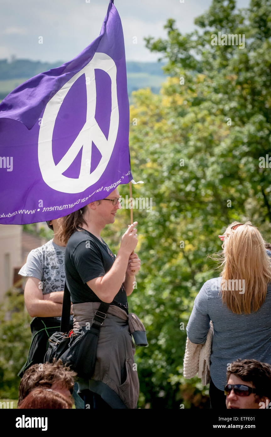 Exeter, Devon, UK. 13th June, 2015. Man holding a CND flag at the Devon ...