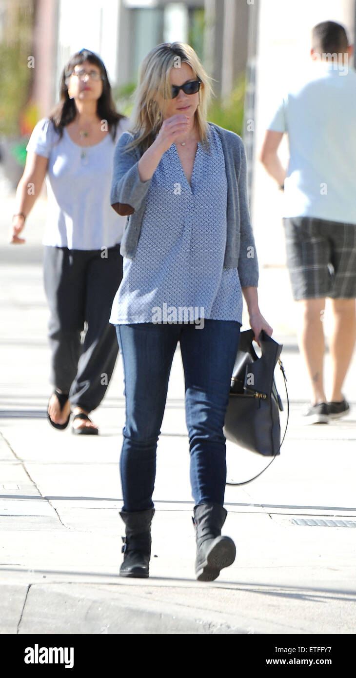 Amy Smart dressed in a crescent patterned top covered with a small grey ...