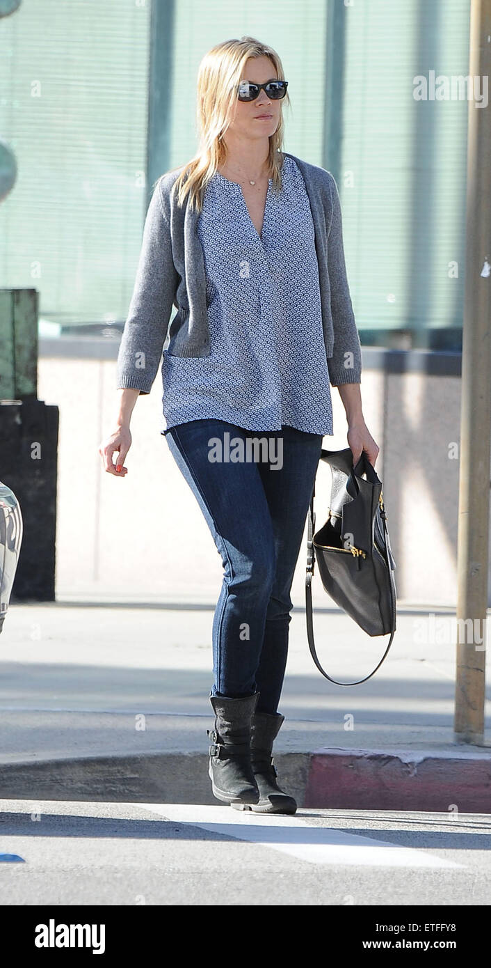 Amy Smart dressed in a crescent patterned top covered with a small grey ...