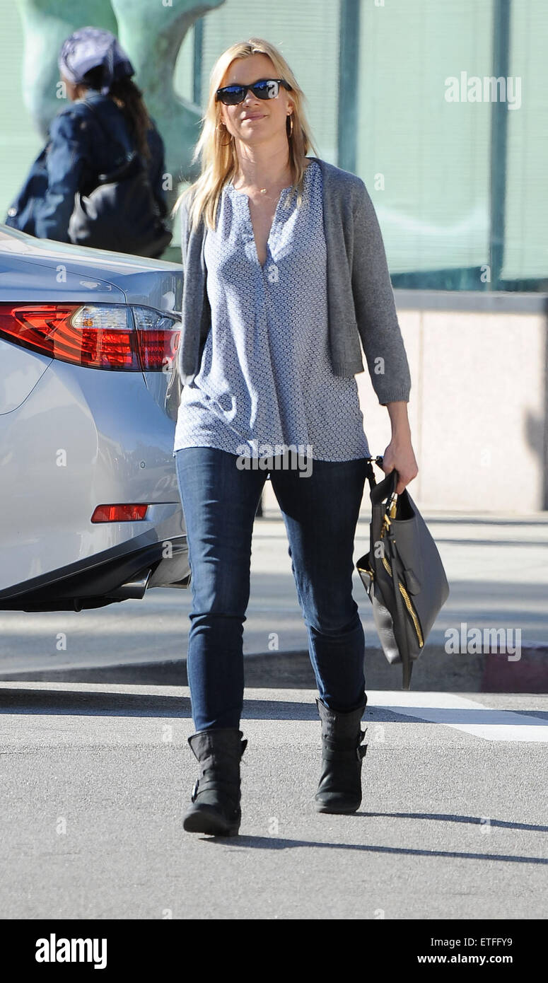 Amy Smart dressed in a crescent patterned top covered with a small grey ...