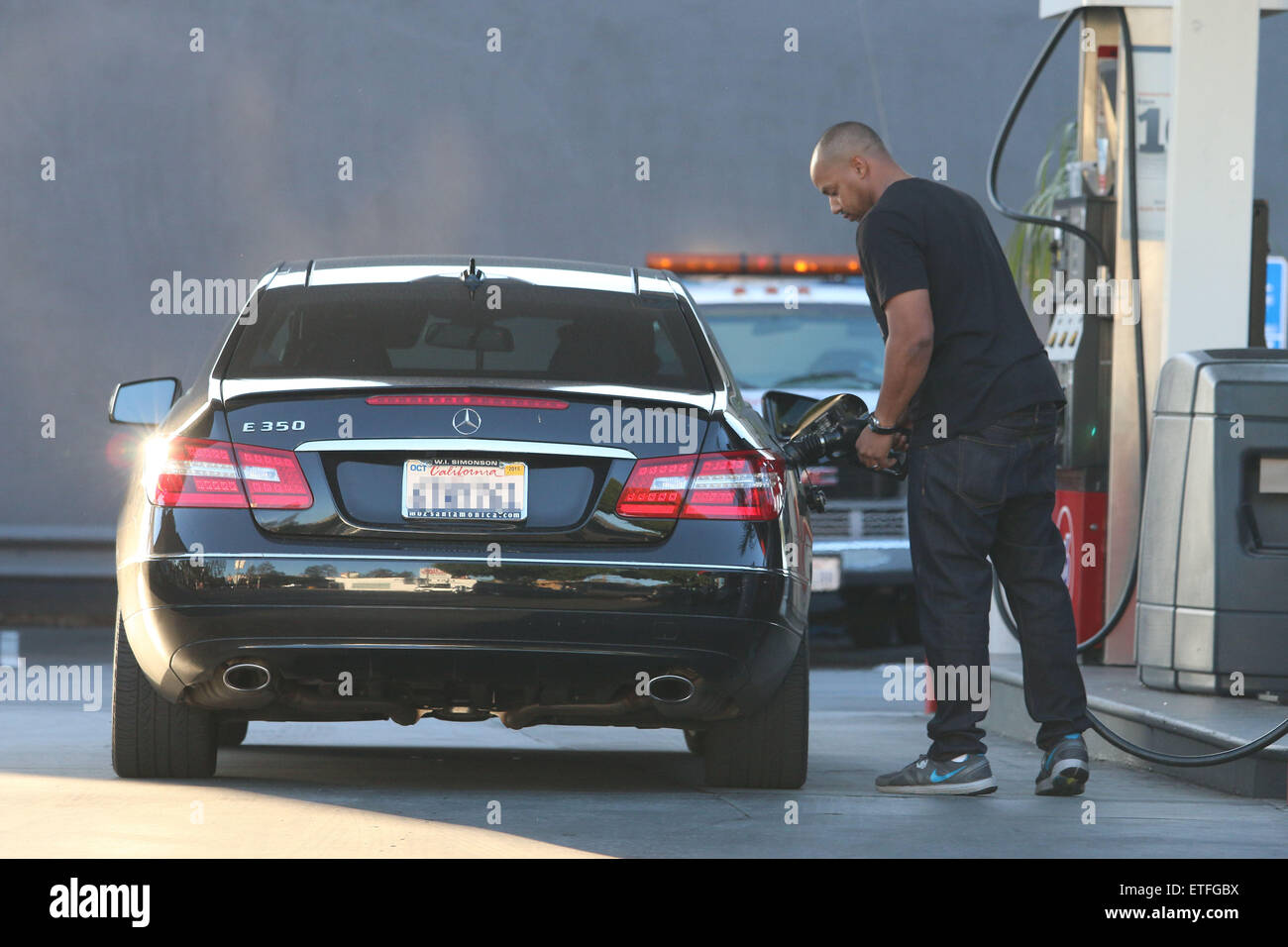Scrubs actor Donald Faison pumping gas in his Mercedes in West ...