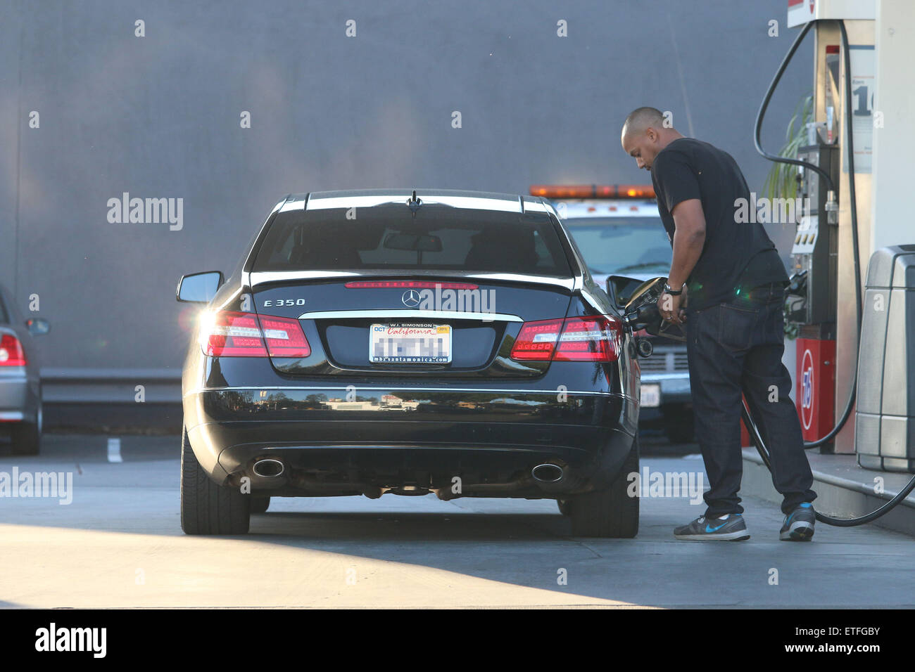 Scrubs actor Donald Faison pumping gas in his Mercedes in West ...